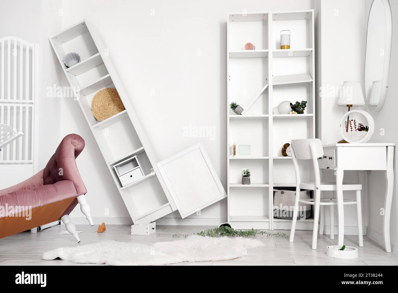 Dressing table with shelving units in messy room Stock Photo - Alamy