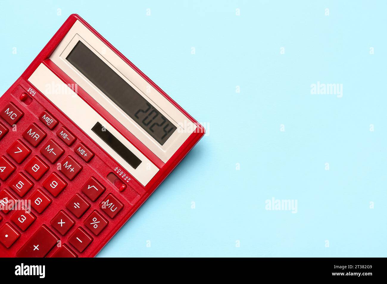 Calculator with number 2024 on blue background Stock Photo - Alamy