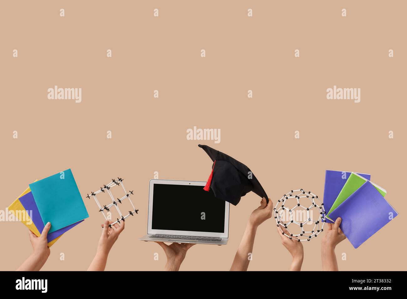 Women with blank laptop, graduation hat, copybooks and molecular models ...