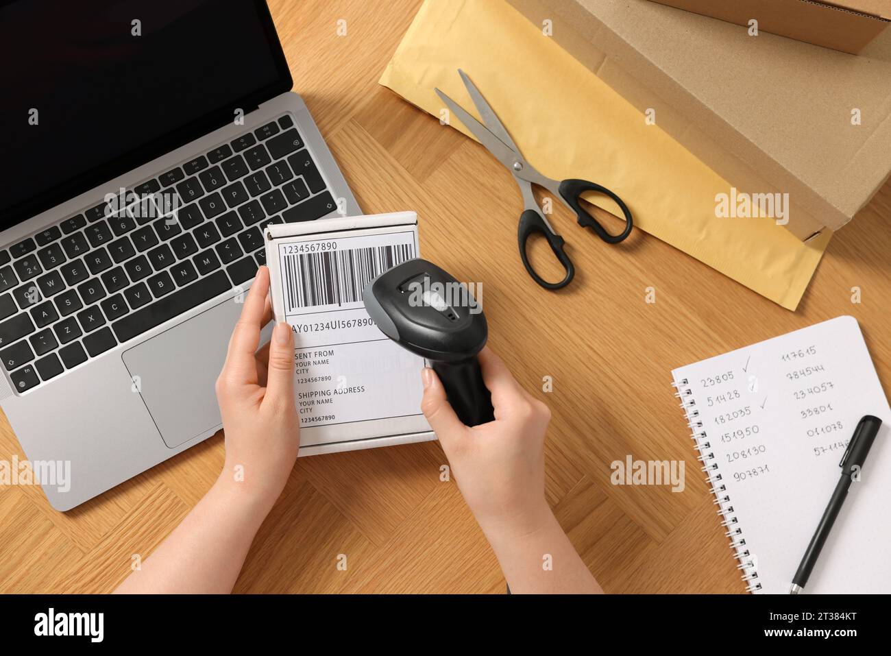 Woman scanner reading parcel hi-res stock photography and images - Alamy