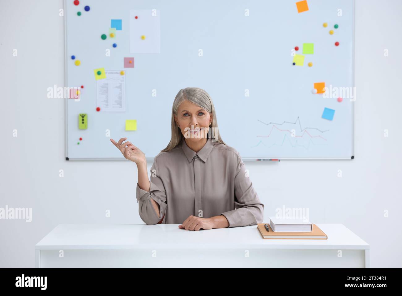 Professor giving lecture desk hi-res stock photography and images - Alamy