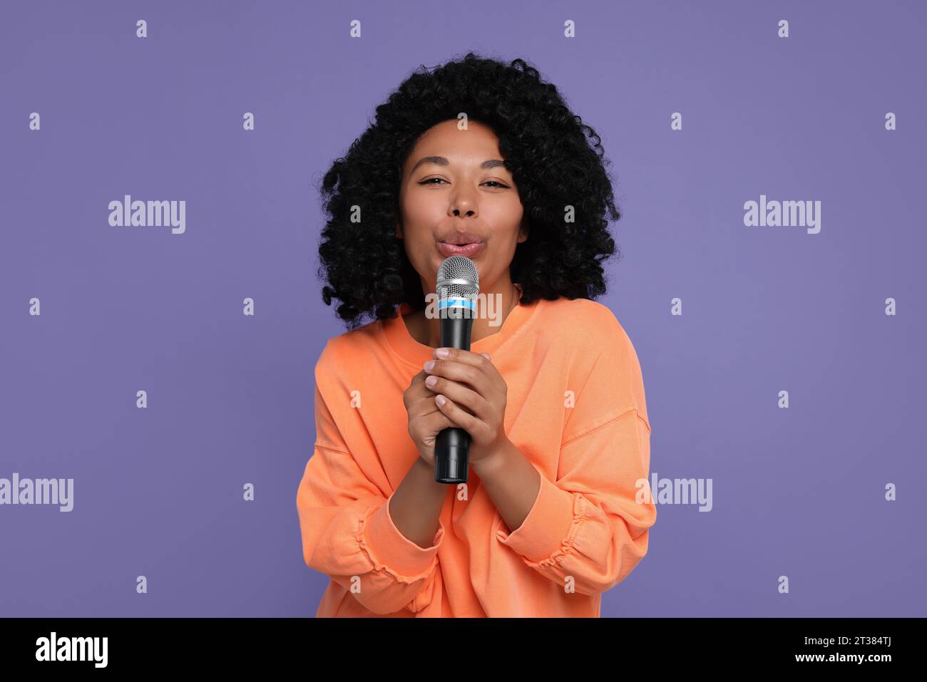Female singer emotionally singing microphone hi-res stock photography ...
