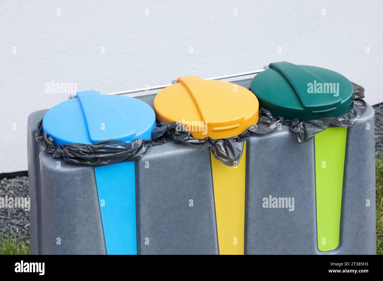 Recycling bins for different garbage outdoors. Waste sorting Stock ...