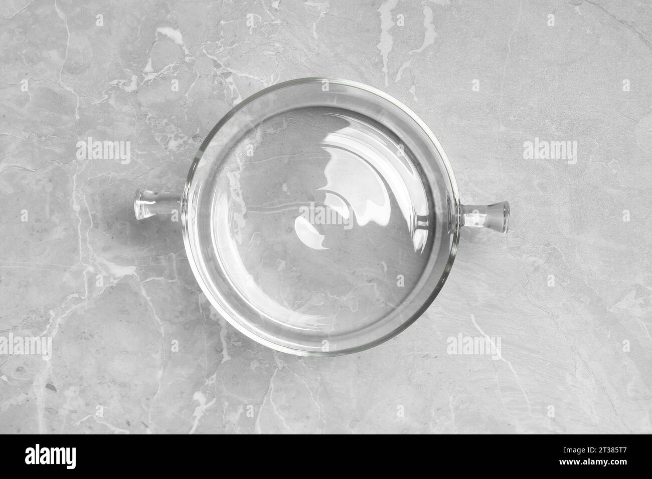 Glass pot with lid on light grey marble table, top view Stock Photo - Alamy