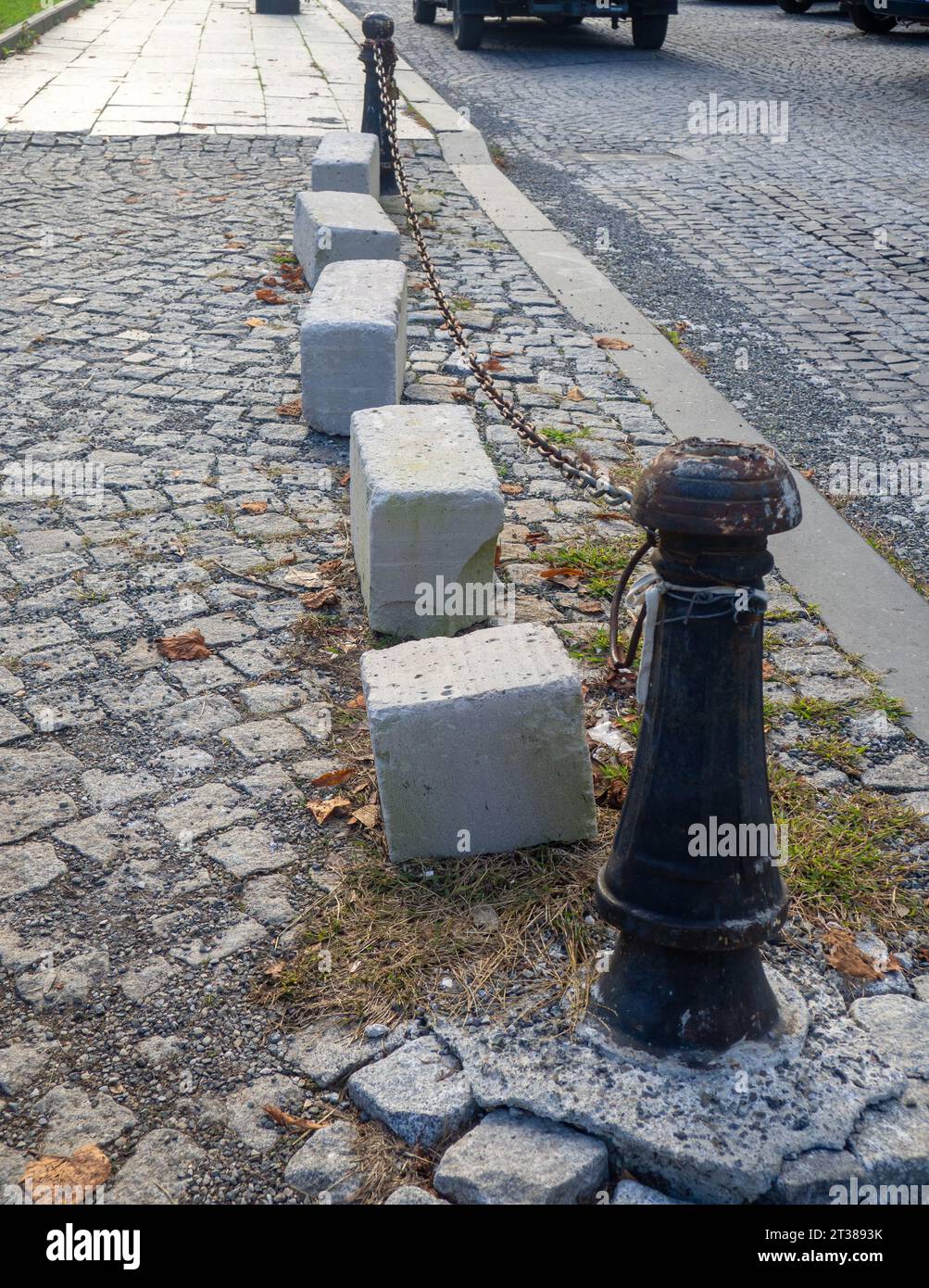 Blocked road concept. The road is blocked with concrete slabs and a ...