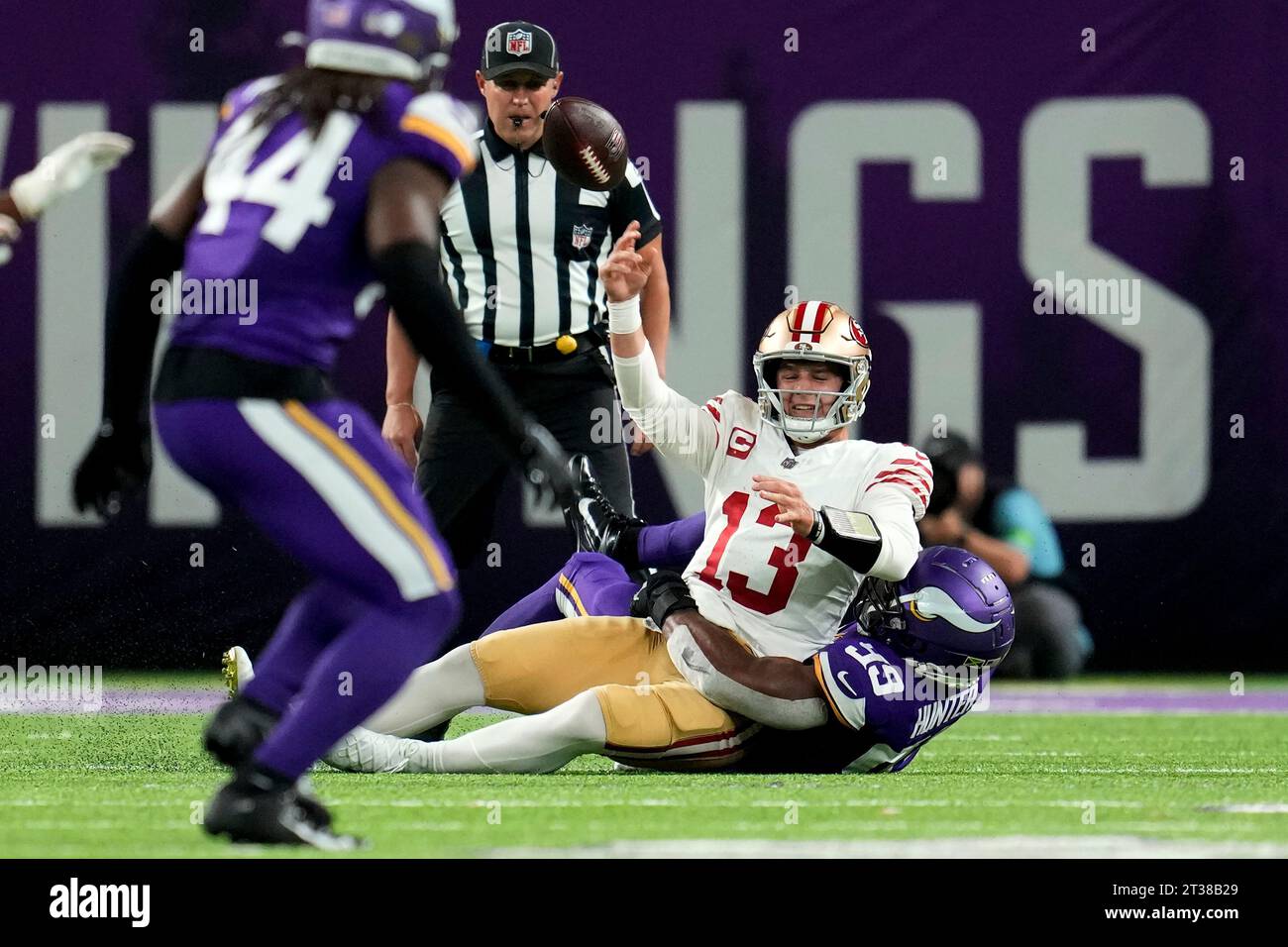 San Francisco 49ers quarterback Brock Purdy (13) is sacked by Minnesota Vikings linebacker ...