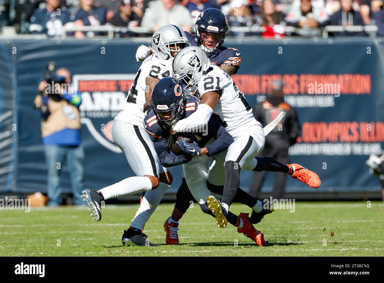 Chicago Bears wide receiver Darnell Mooney (11) is tackled by Las Vegas ...