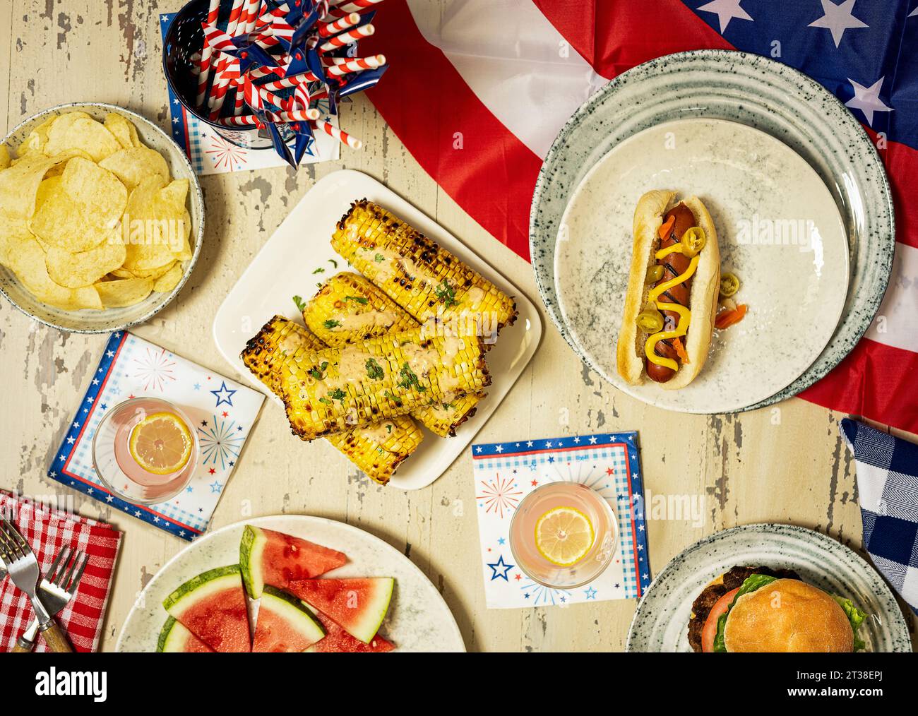 July 4th hotdog with watermelon, potato chips, corn and pink lemonade ...
