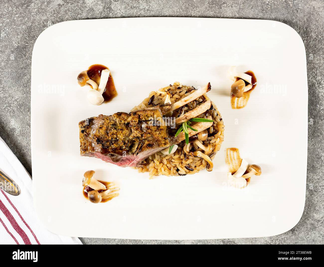 Above view of lamb with wild rice plated Stock Photo - Alamy