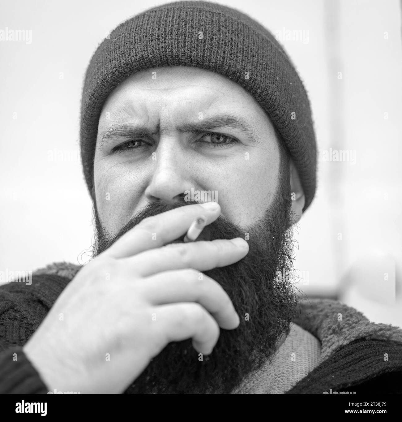 Cigarette nicotine addiction. Hipster brutal man smoking cigarette ...