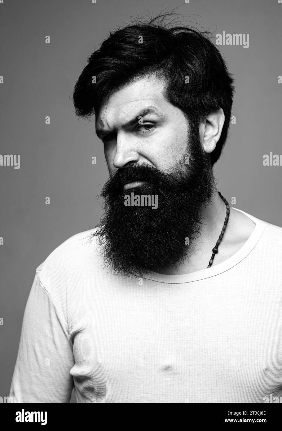 Portrait of confident serious man. Hipster guy models in studio ...