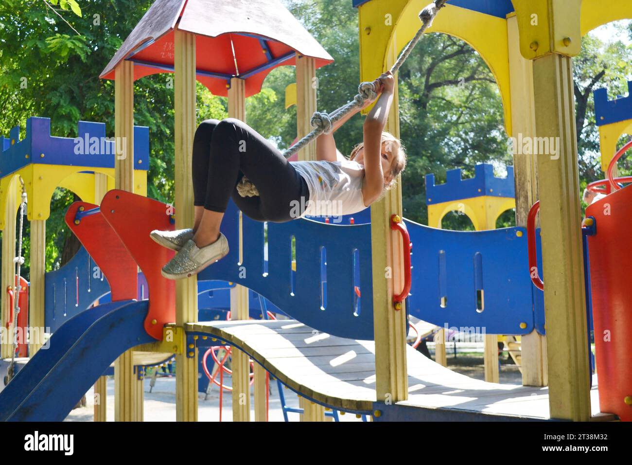 Little children run around and play in the playground. Game center for ...