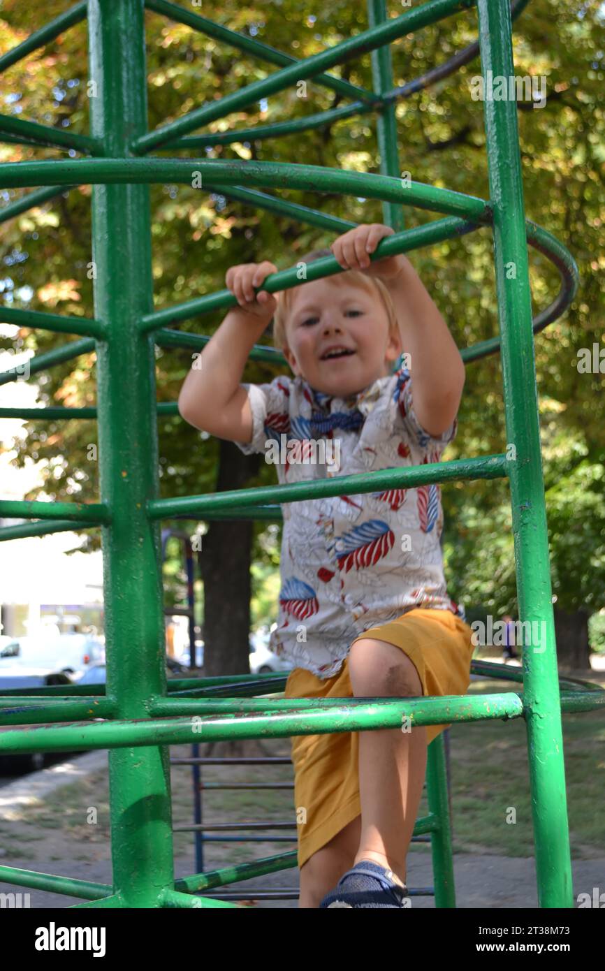 Little children run around and play in the playground. Game center for ...