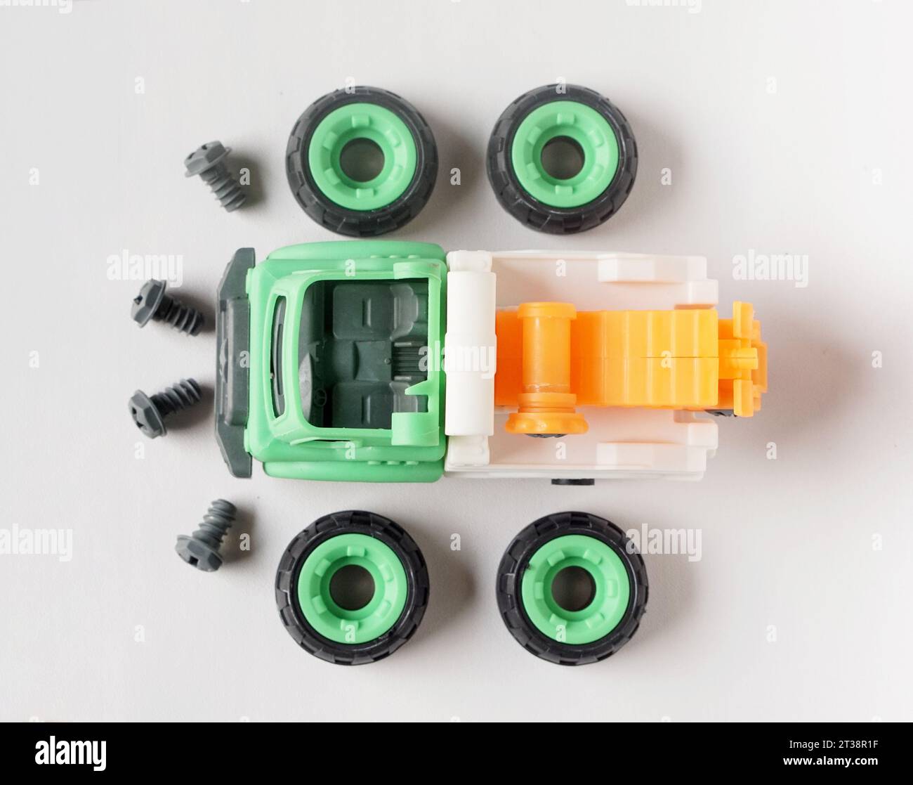 Top view of plastic towing truck toy with bolt and screwdriver isolated ...