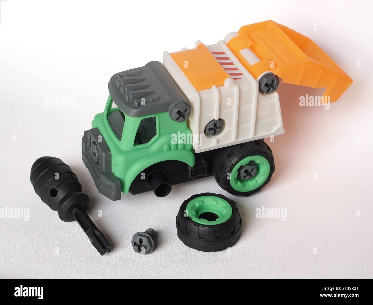 plastic towing truck toy with bolt and screwdriver isolated on white ...