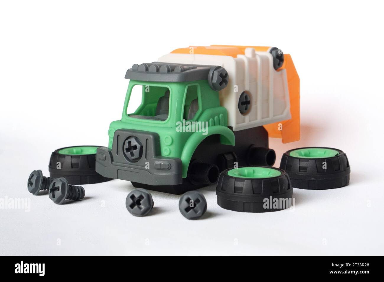 plastic towing truck toy with bolt and screwdriver isolated on white ...