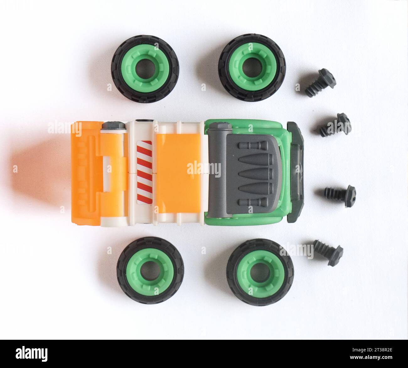 Top view of plastic garbage truck toy with bolt and screwdriver ...