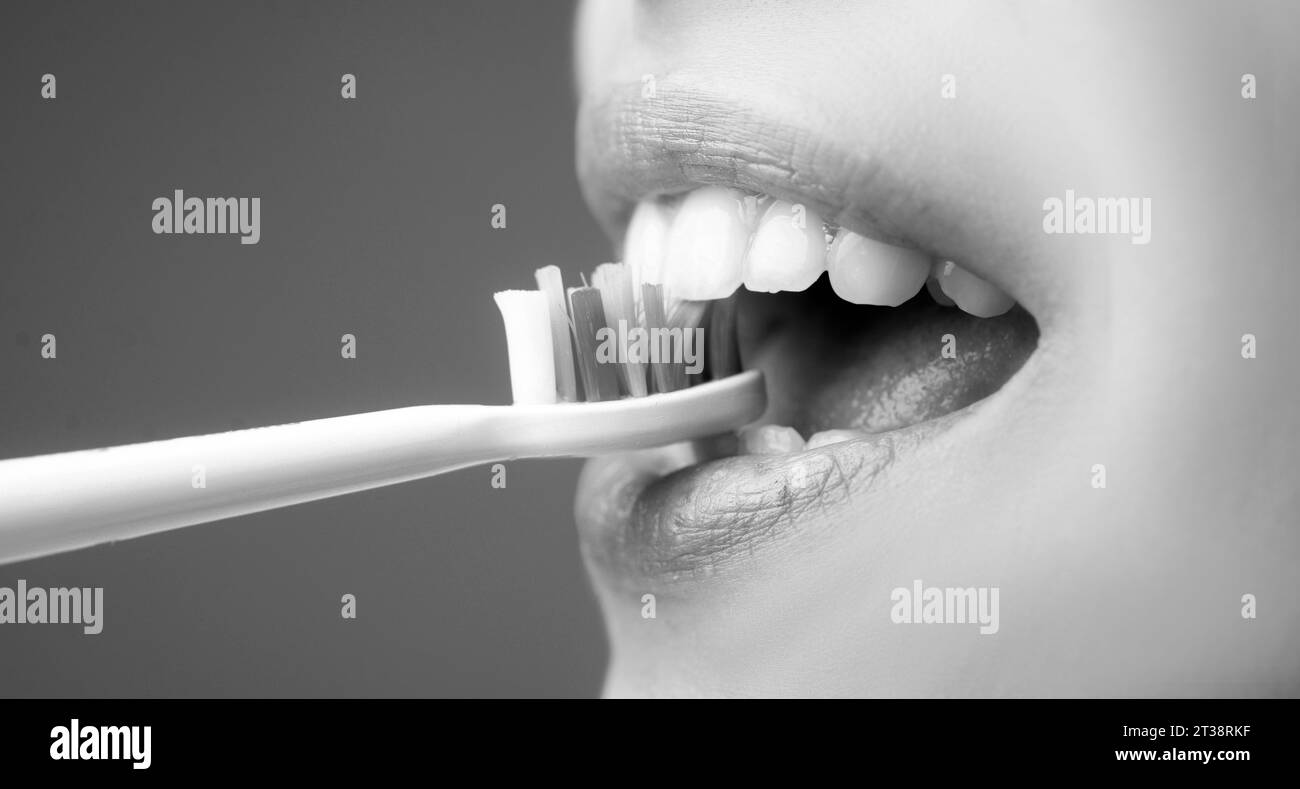 Woman mouth brushing teeth. Beautiful smile of young woman with healthy ...