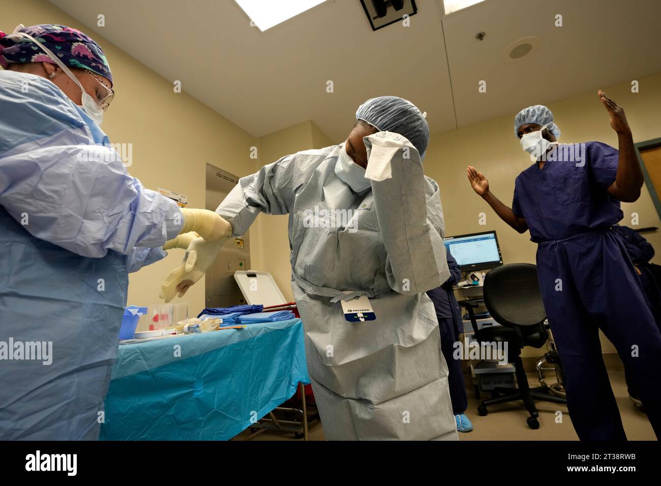 Meharry Medical College students Teresa Belledent, center, is helped ...
