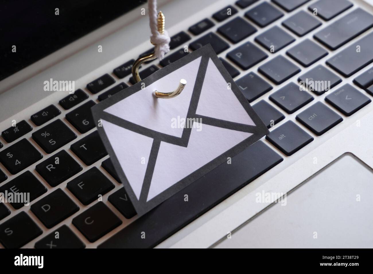 Closeup image of mail with hook on top of keyboard. Phishing email ...