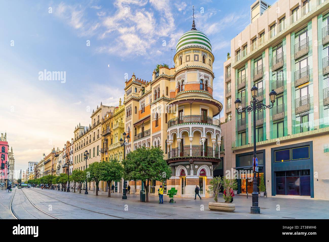 Old town in Seville, shopping street in Spain at sunrise Stock Photo ...