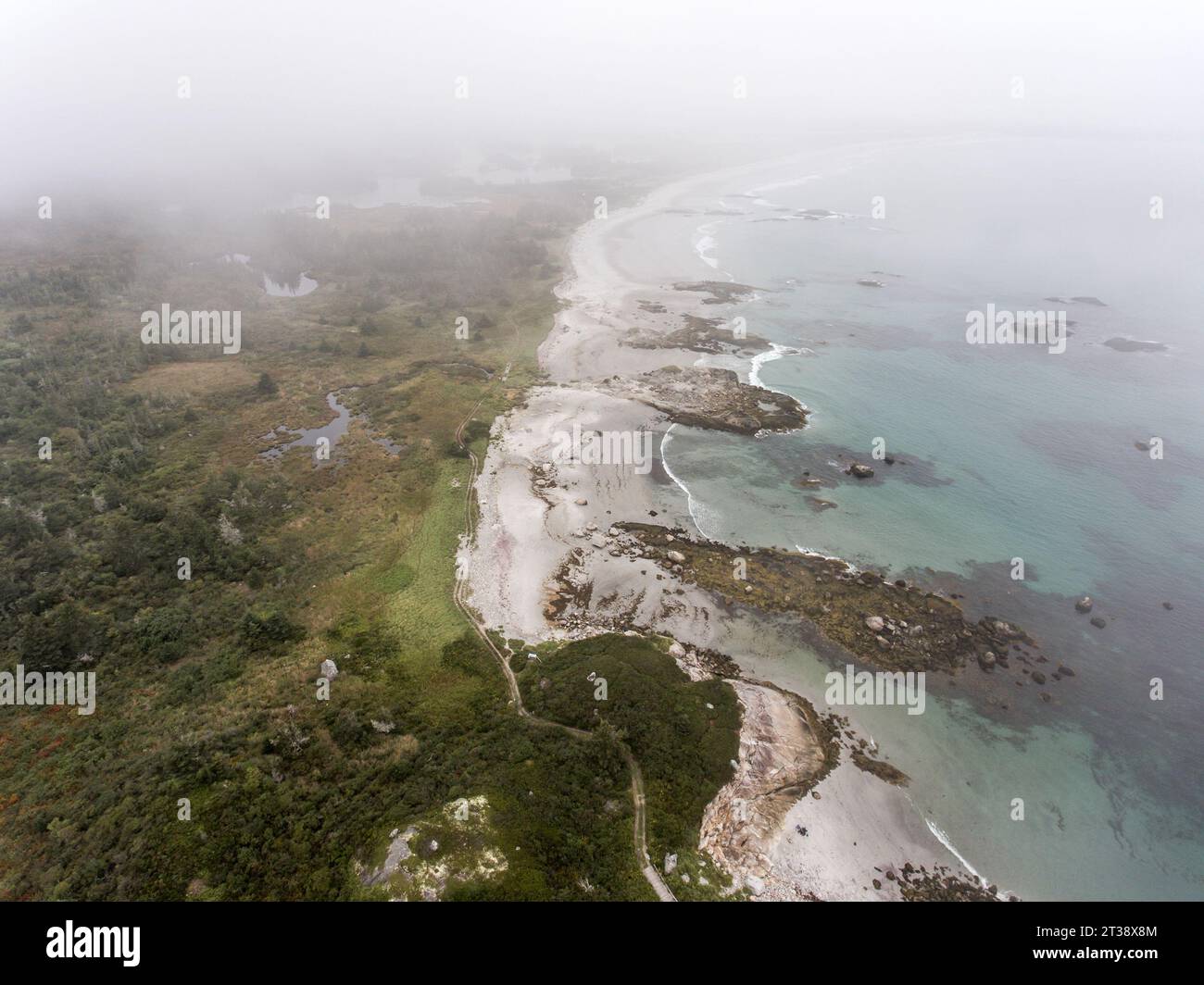 Exploring the beach in the mist morning at Kejimkujik National Park ...