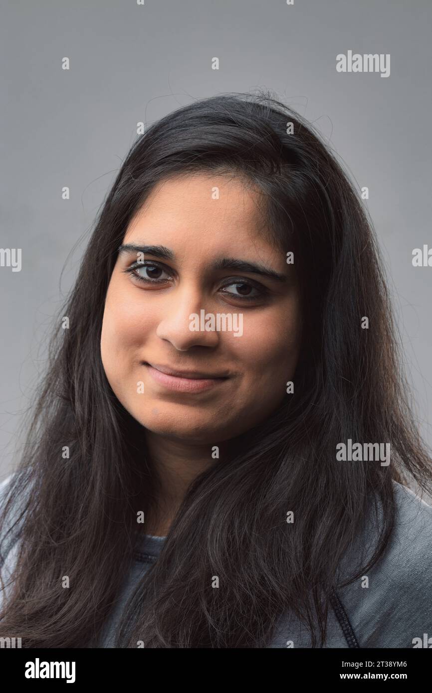 Displayed is a young woman of Indian descent. Her long raven-black hair ...