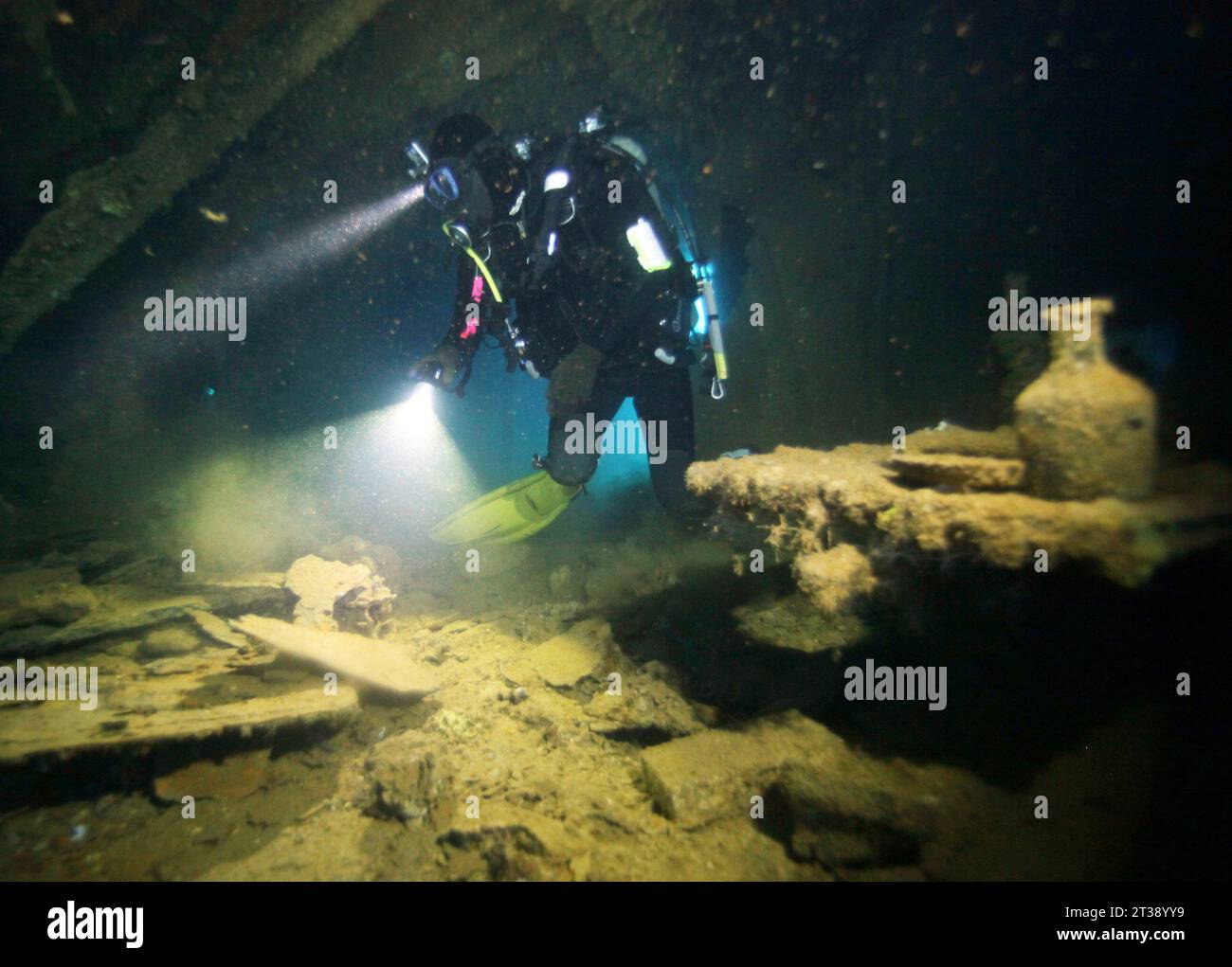 A diver searches for human remains in the Shinkoku Maru, an oil tanker ...