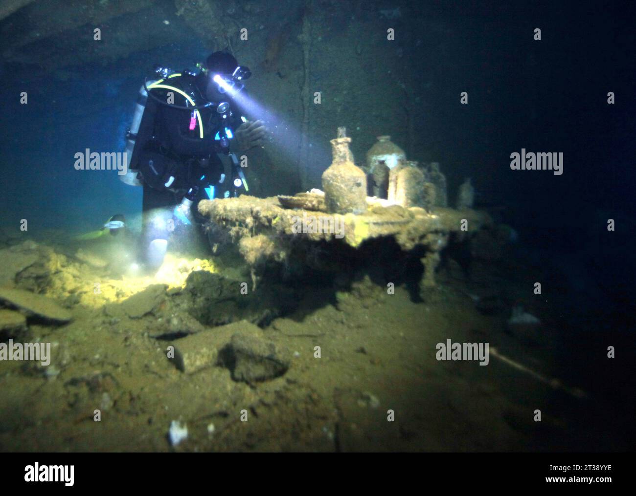 A diver prays after confirming human remains in the Shinkoku Maru, an ...