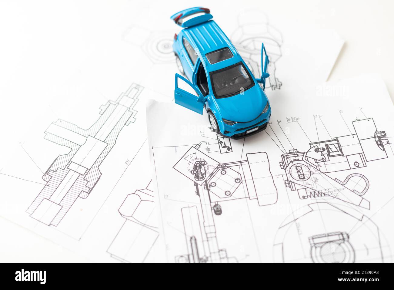 small car model and blueprint sheets Stock Photo - Alamy