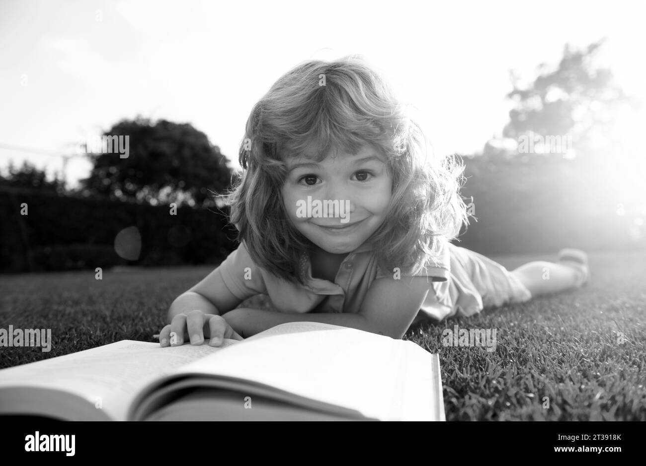 Clever boy reading book Black and White Stock Photos & Images - Alamy