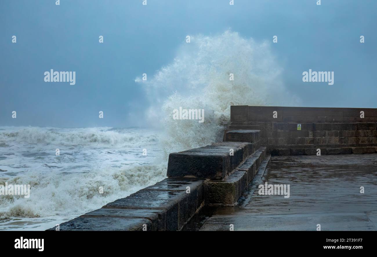 Very high waves coming over a harbour wall during a storm Stock Photo ...