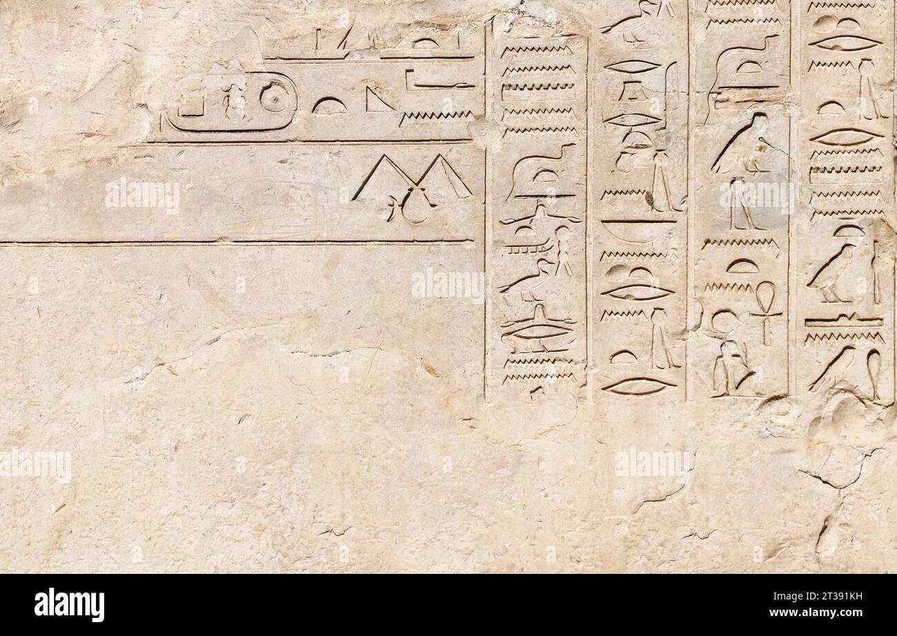 Horizontal background with ancient Egyptian hieroglyphs on stone wall ...