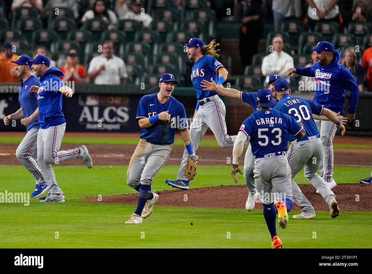 The Texas Rangers celebrate after Game 7 of the baseball AL ...