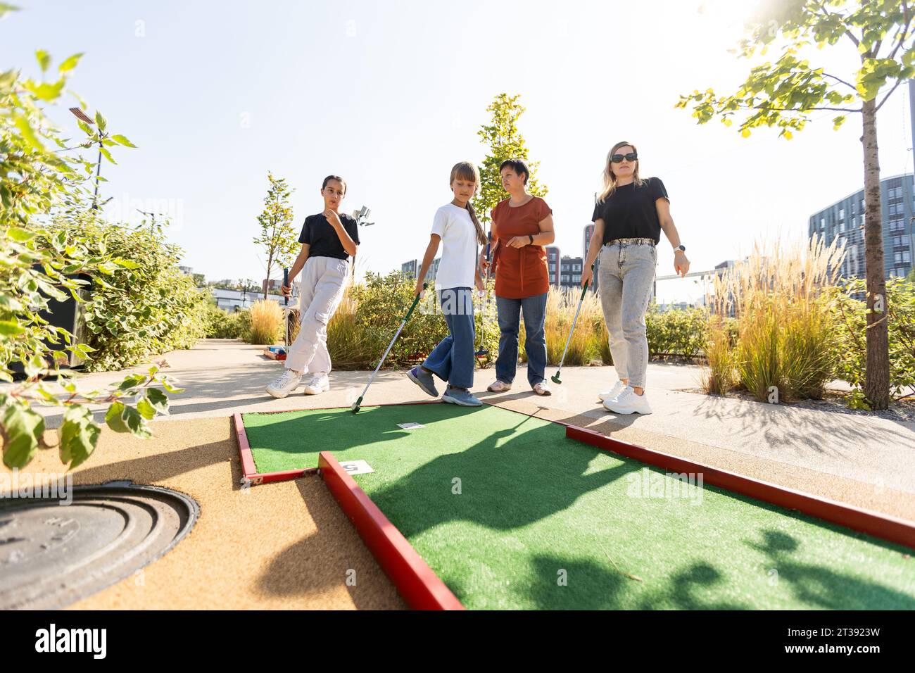 Golf course group of friends people with children posing standing Stock ...