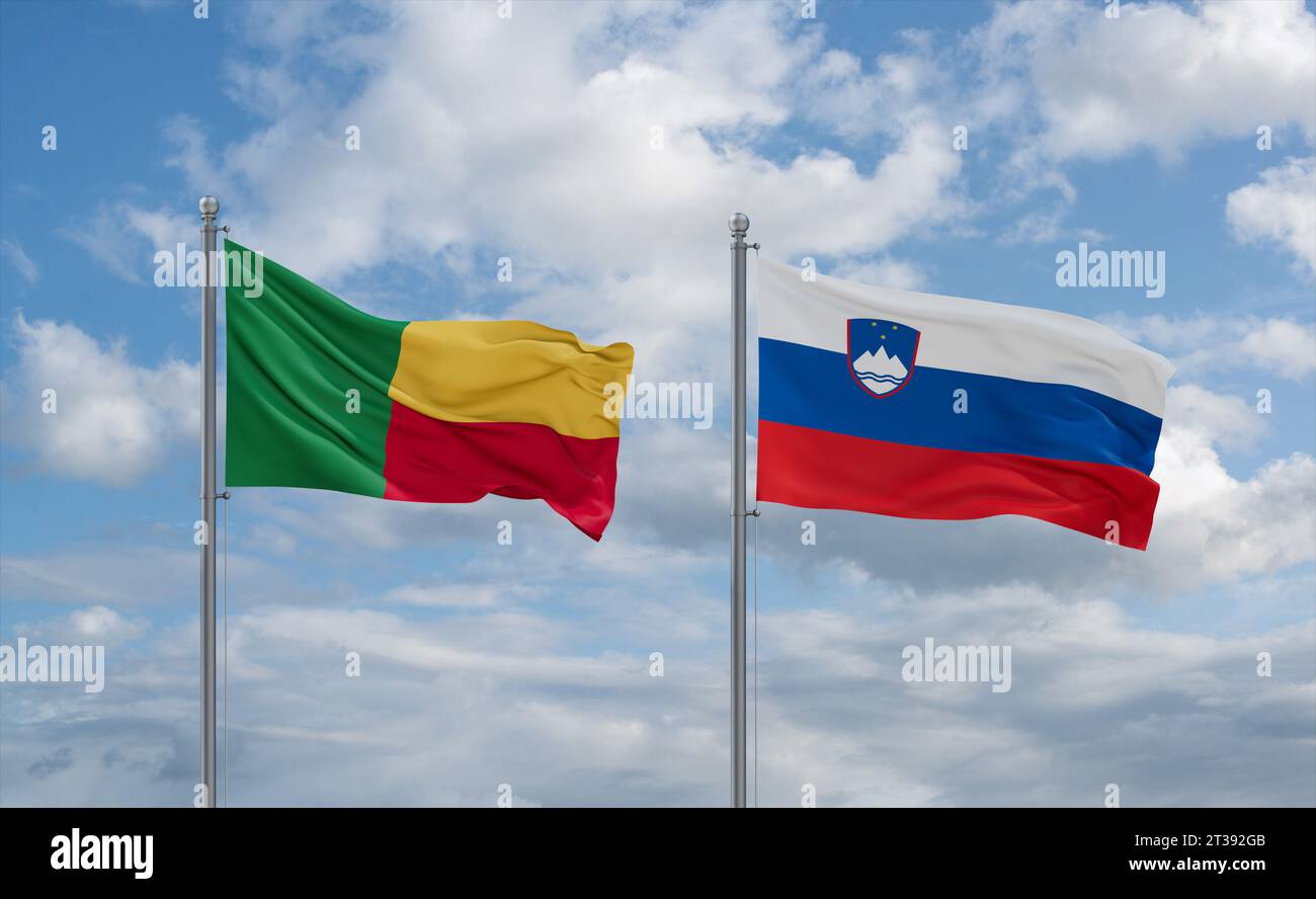 Slovenia and Benin flags waving together in the wind on blue cloudy sky, two country ...