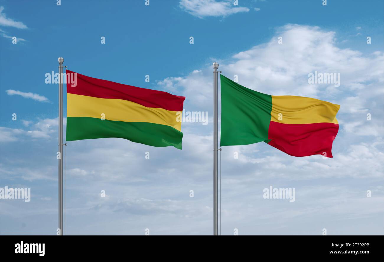 Benin and Bolivia flags waving together on blue cloudy sky, two country relationship concept ...