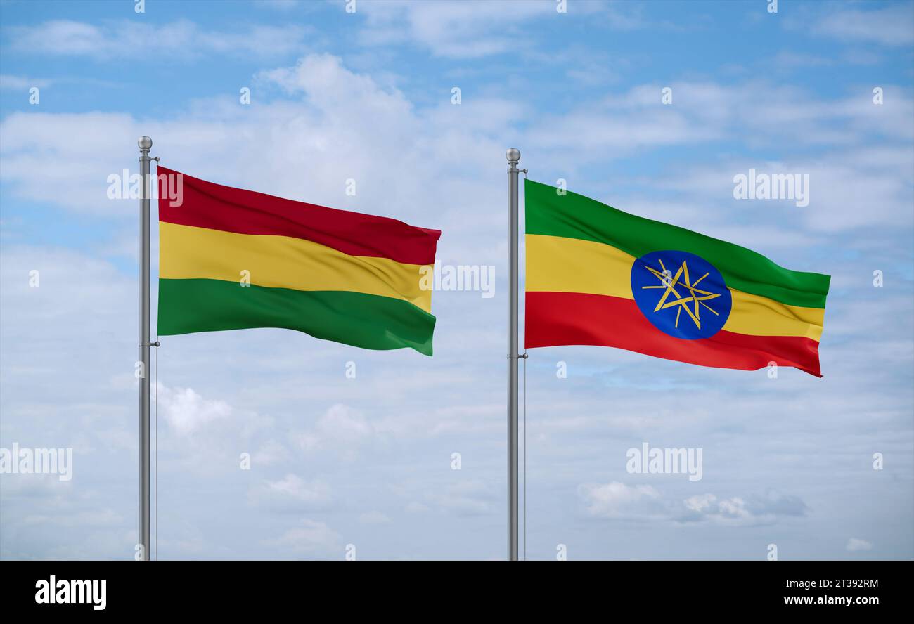 Ethiopia and Bolivia flags waving together on blue cloudy sky, two country relationship concept ...