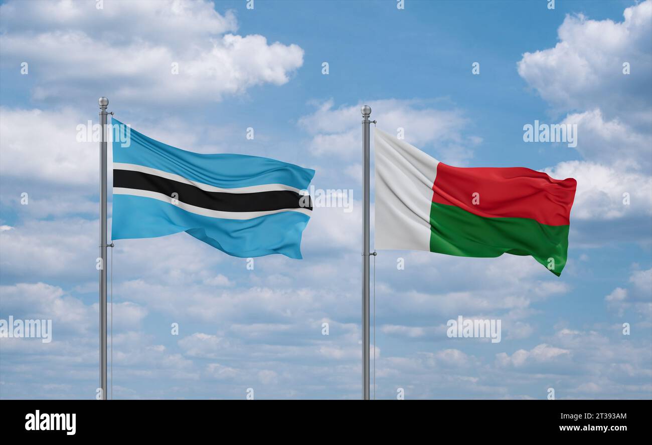 Madagascar and Botswana flags waving together on blue cloudy sky, two country relationship ...