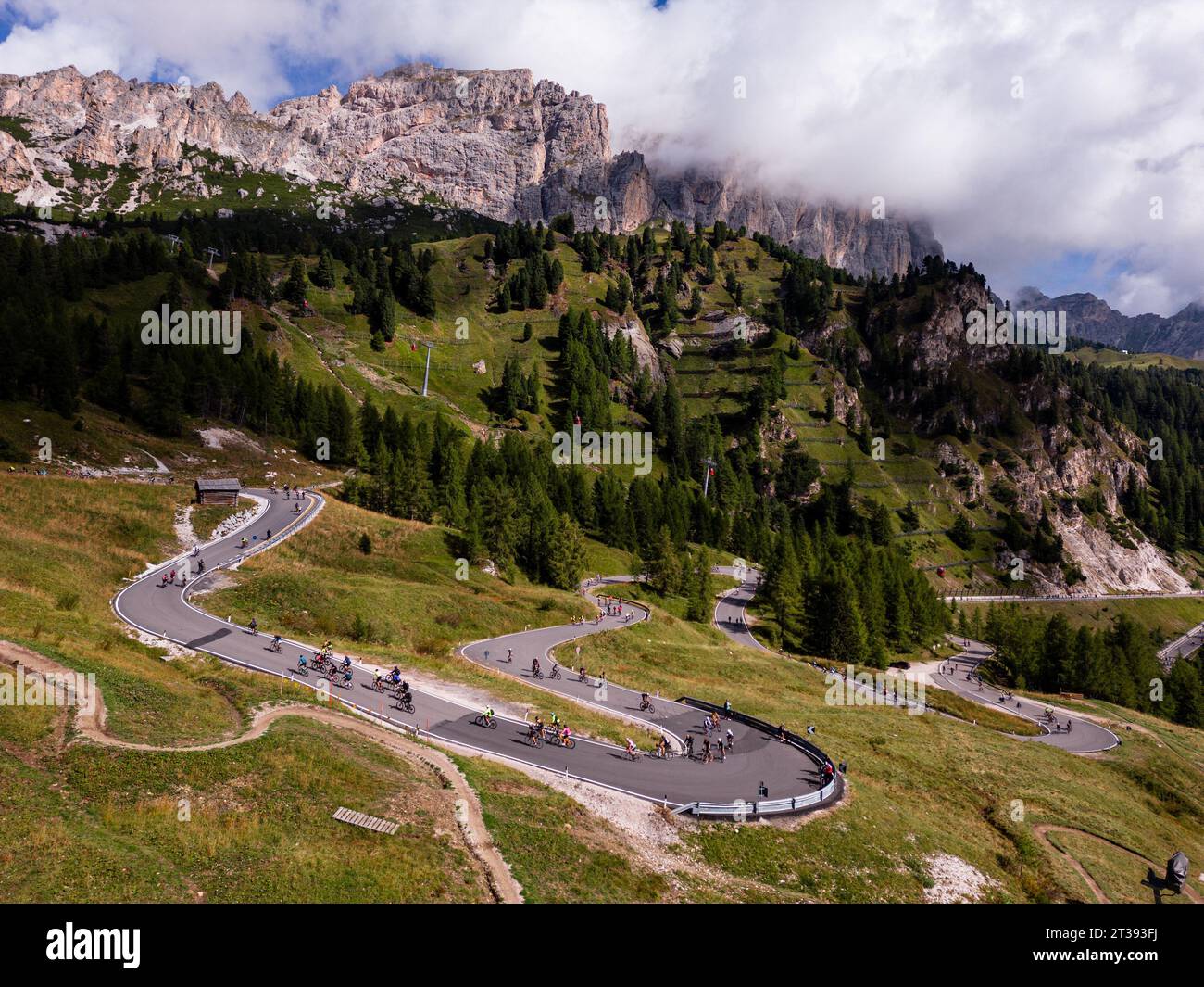An aerial view of cyclists on a road in green mountains Stock Photo - Alamy