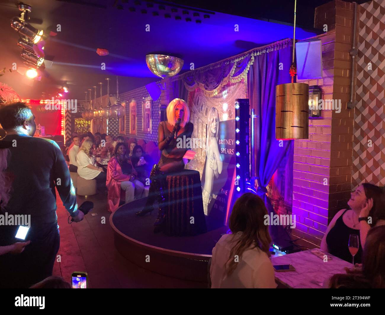 Drag performer Margo Marshall reads an extract from The Woman in Me at ...