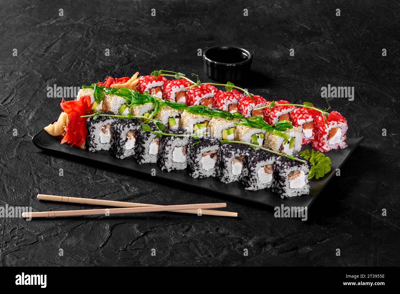 Set of sushi rolls with salmon, eel, avocado, cream cheese, masago and ...