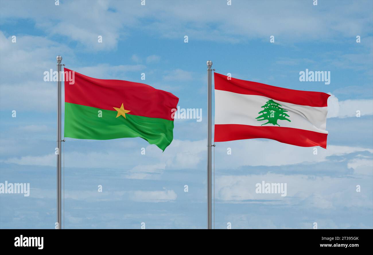 Lebanon and Burkina Faso flags waving together in the wind on blue ...