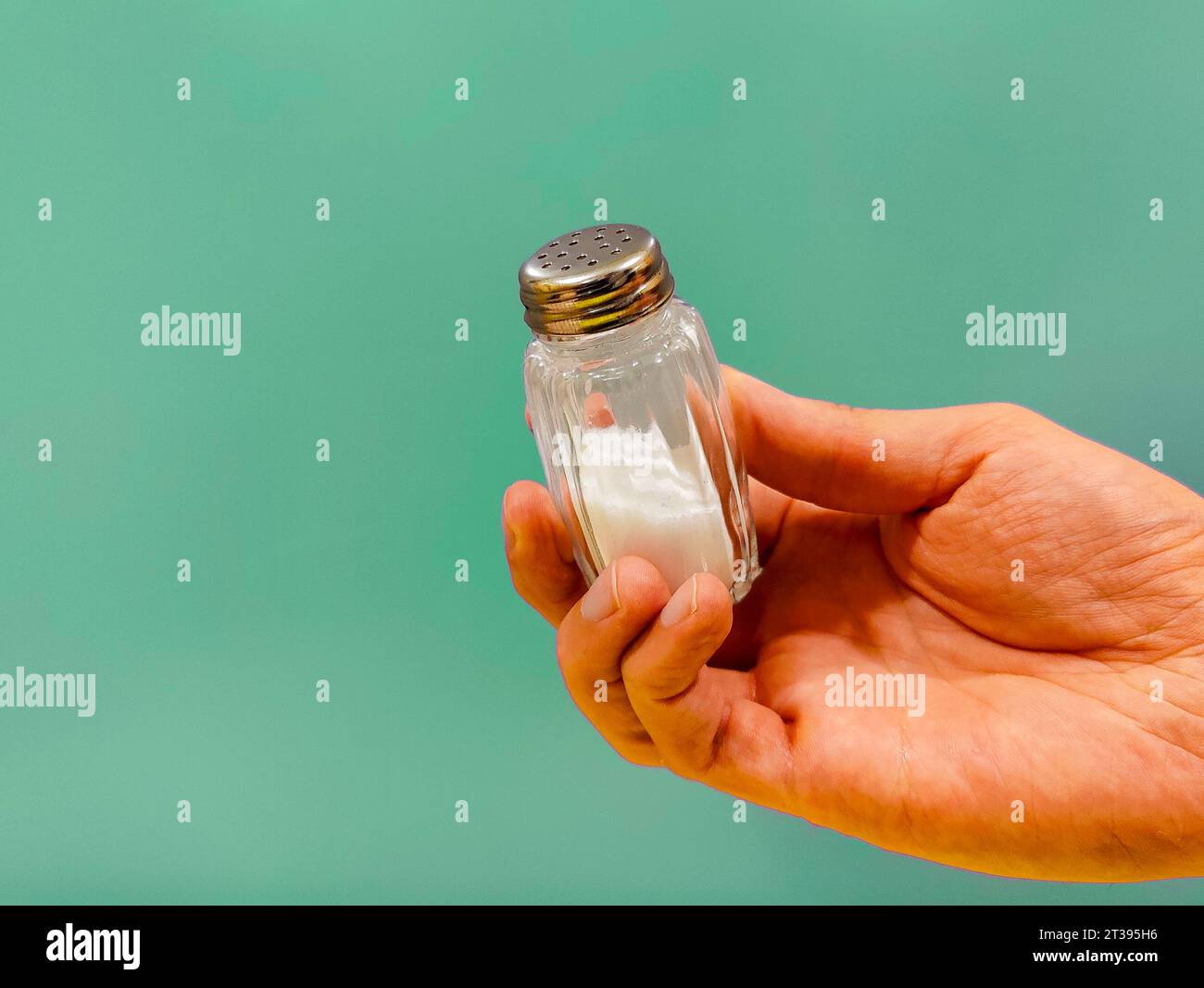 Hand holding salt hi-res stock photography and images - Alamy