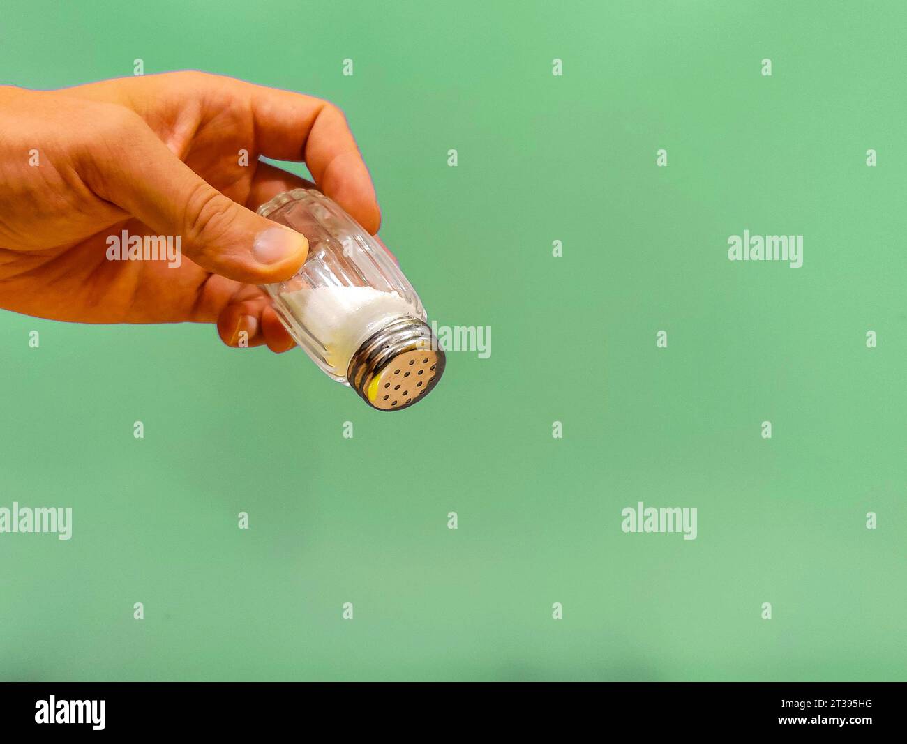 Hand holding salt hi-res stock photography and images - Alamy