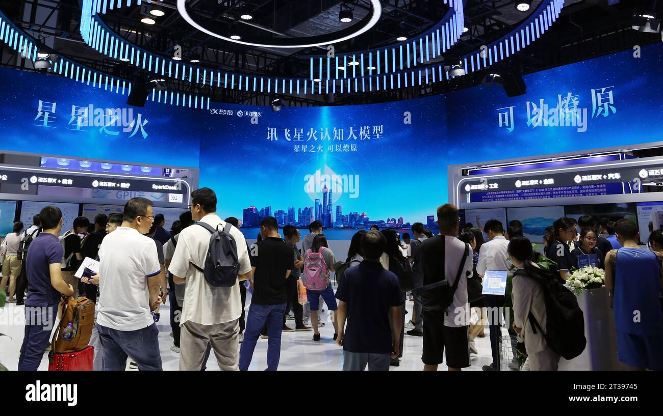 Spectators look at IFlytek's Spark Desk at the World Artificial ...