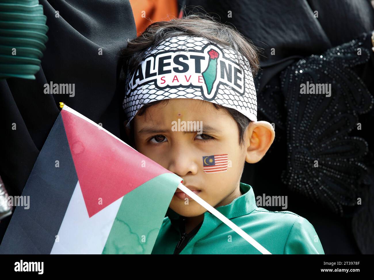 Kuala Lumpur, Malaysia. 22nd Oct, 2023. A young Muslim boy holds ...