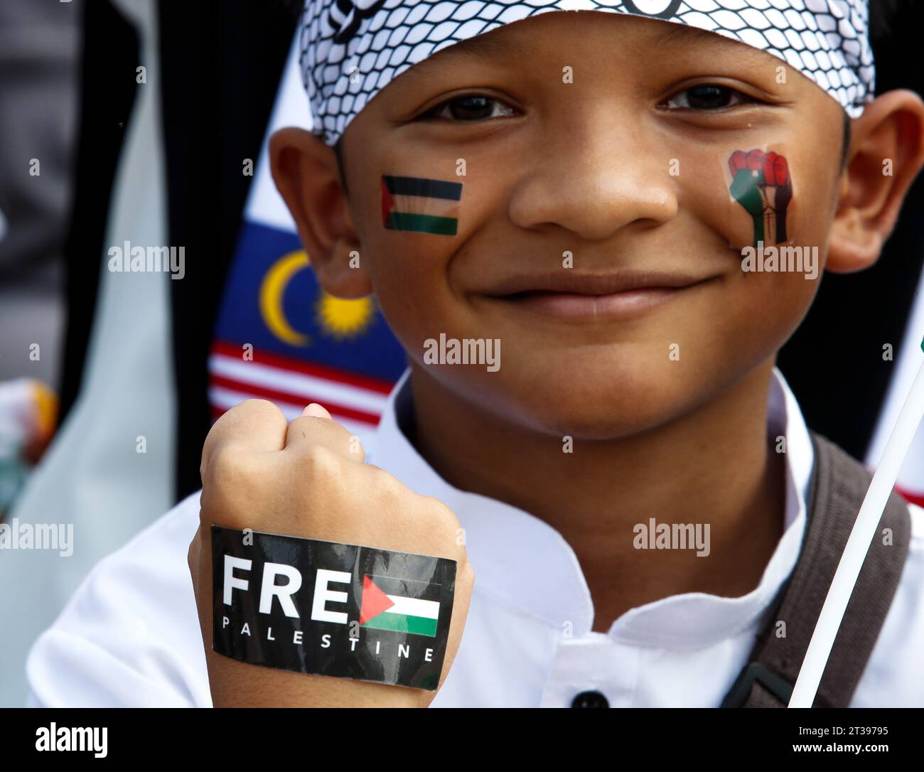Kuala Lumpur, Malaysia. 22nd Oct, 2023. A young boy with stickers seen ...