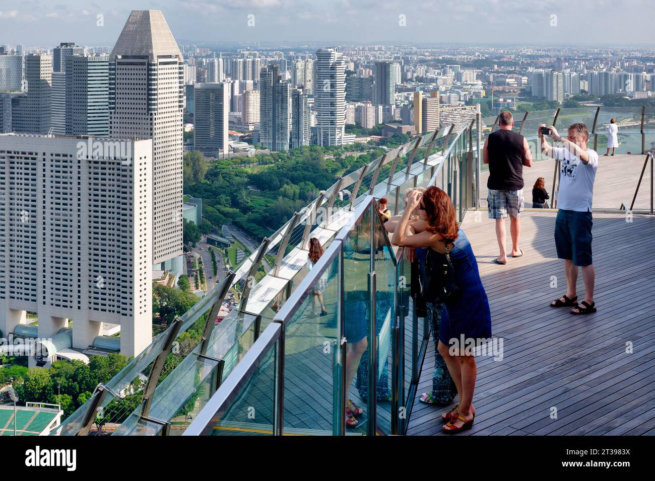 Tourists enjoying the vantage view over Singapore's inner city from the ...