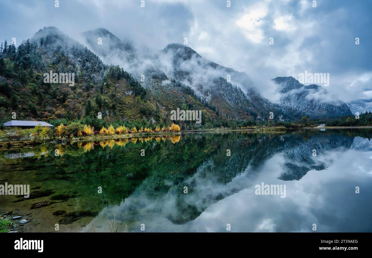 Aerial photo shows the autumn snowy scenery of Bipenggou Valley scenic ...